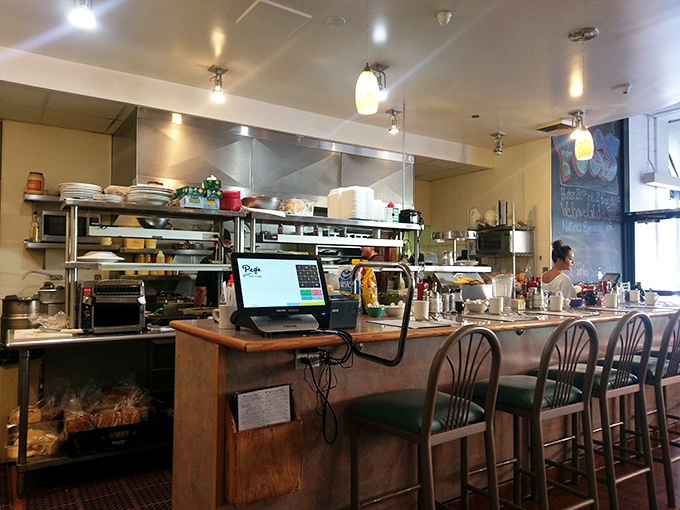 Counter seating: where solo diners become temporary neighbors and the kitchen's symphony of sizzles and clangs provides the morning soundtrack.