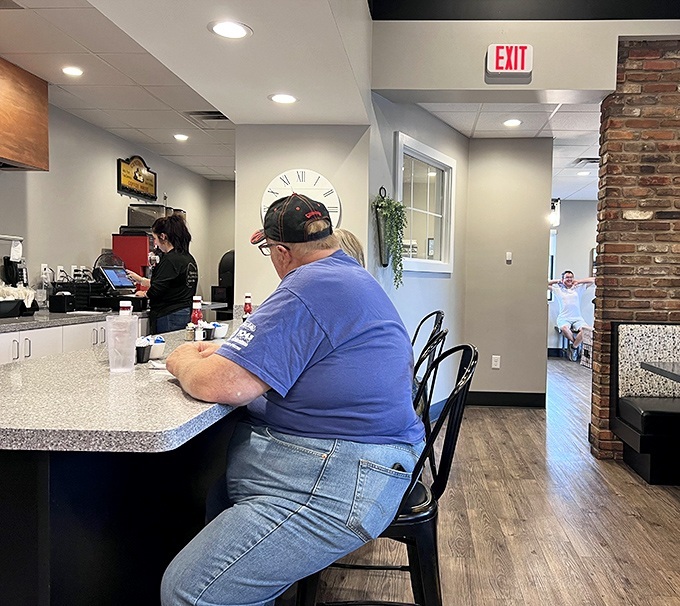 The counter seating offers front-row tickets to the breakfast theater, where regulars exchange knowing nods that say, "Yes, we've made excellent life choices today."
