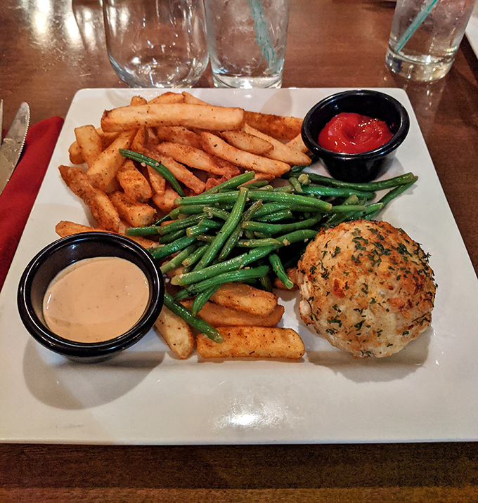 This crab cake dinner isn't playing games &ndash; all crab, minimal filler, and served with fries that deserve their own fan club.