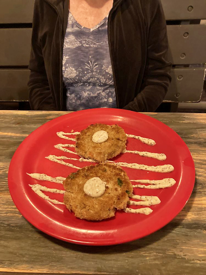 Crab cakes with artistic sauce drizzles&mdash;seafood transformed into comfort food that would make Maryland jealous of Florida's crab game.