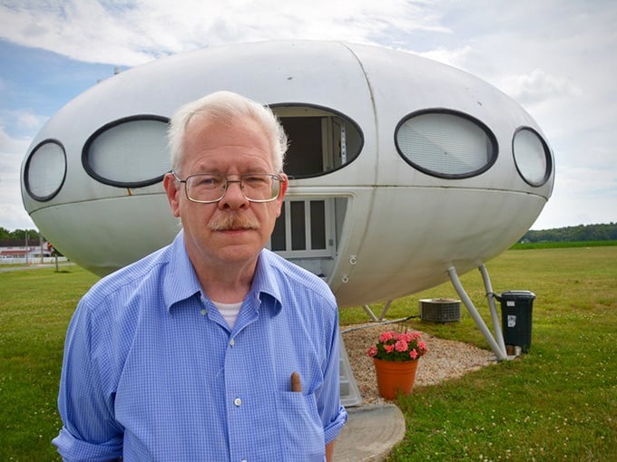 Standing proudly beside his unusual dwelling, this caretaker of cosmic architecture keeps Delaware's quirkiest landmark alive.