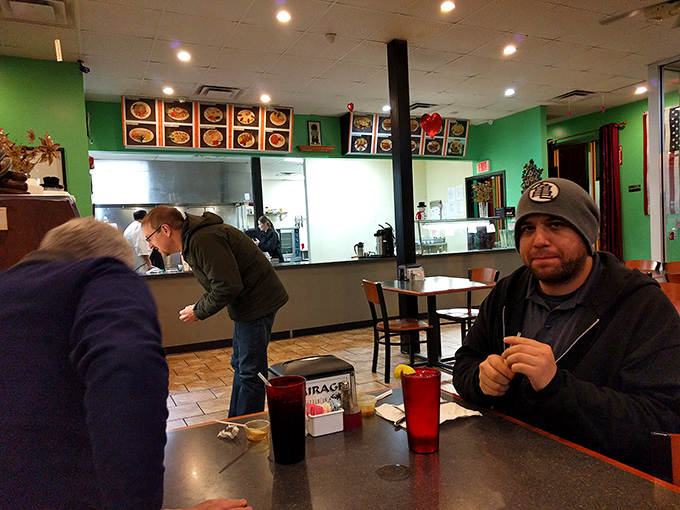 Happy diners enjoying their meals in the relaxed atmosphere where the only dress code is "come hungry, leave satisfied."