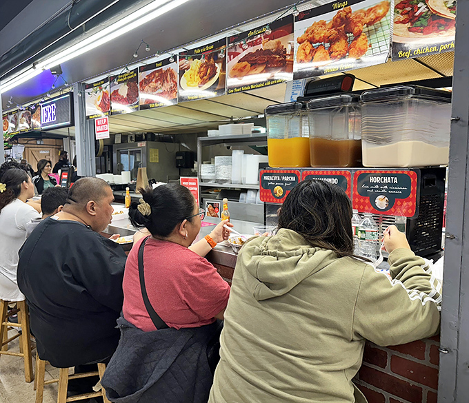 The busy food counter draws crowds who know authentic flavors when they see them being freshly prepared.