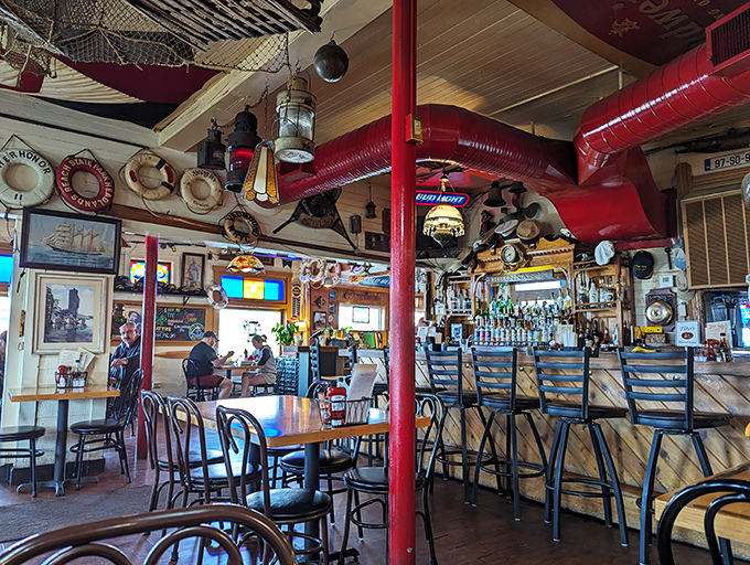 The ceiling at Brennan's isn't just decorated &ndash; it's curated with decades of maritime treasures that could keep conversation flowing longer than the Grand River itself.