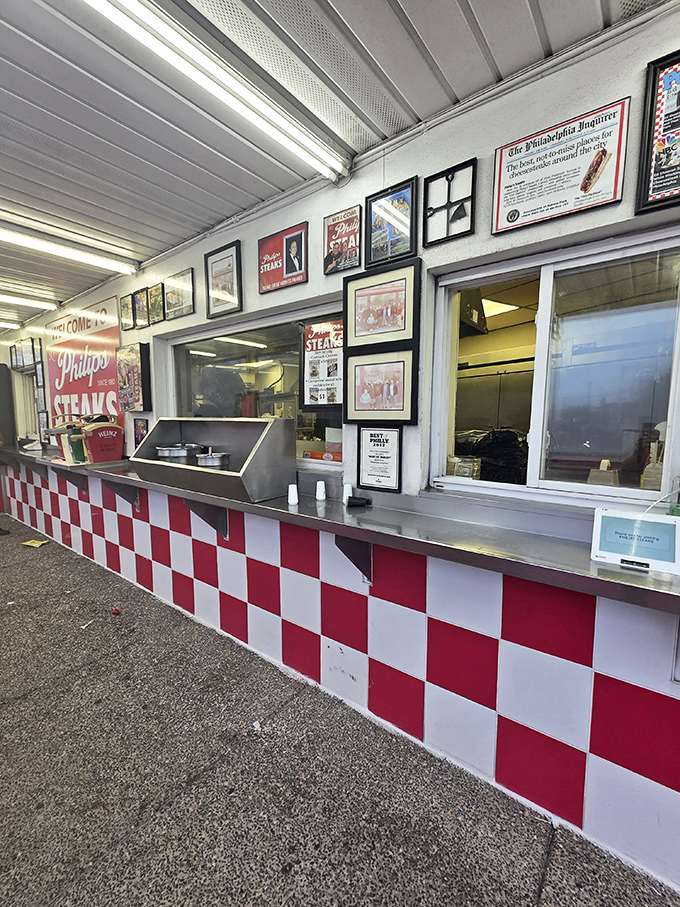 The framed articles aren't just decoration—they're the paper trail of a sandwich legacy that's earned its place in Philly history.