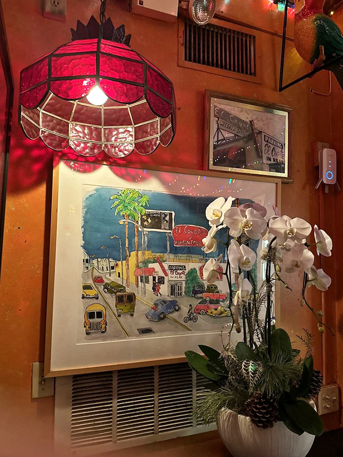 The wall art tells stories of El Coyote's past while colorful lanterns cast the kind of flattering light that makes everyone look like they're on vacation.