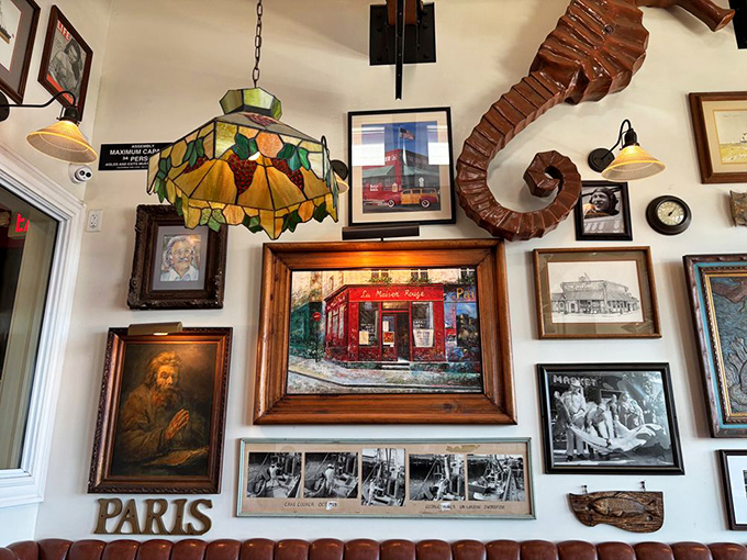 That wooden seahorse on the wall watches over a collection of art that spans continents—proof that seafood appreciation is a universal language.