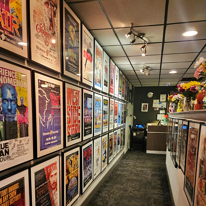 The hallway gallery wall showcases theatrical posters, adding a dash of Broadway glamour to your pre-dinner stroll.