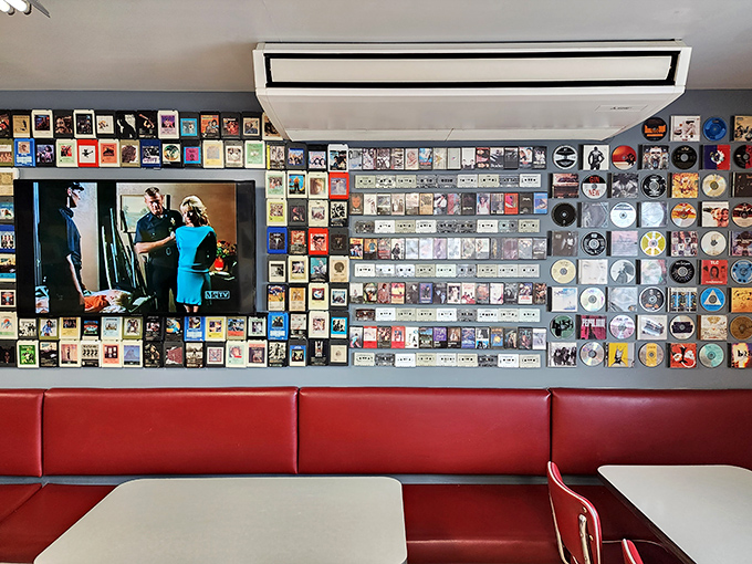 More album covers line the walls, creating a timeline of American music history that pairs perfectly with the timeline of American diner classics on your plate.