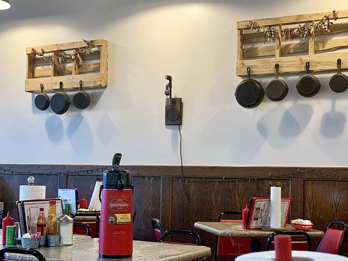 Cast iron pans stand ready on their wooden perches, like culinary soldiers awaiting their next delicious mission. These are the tools of breakfast artistry.