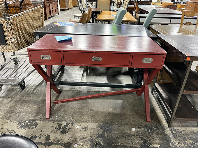 This crimson campaign desk isn't just furniture—it's a conversation piece waiting to elevate your home office from mundane to magnificent.