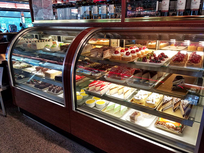 A rotating display case of desserts that makes willpower vanish faster than your uncle's hairline &ndash; resistance is futile.