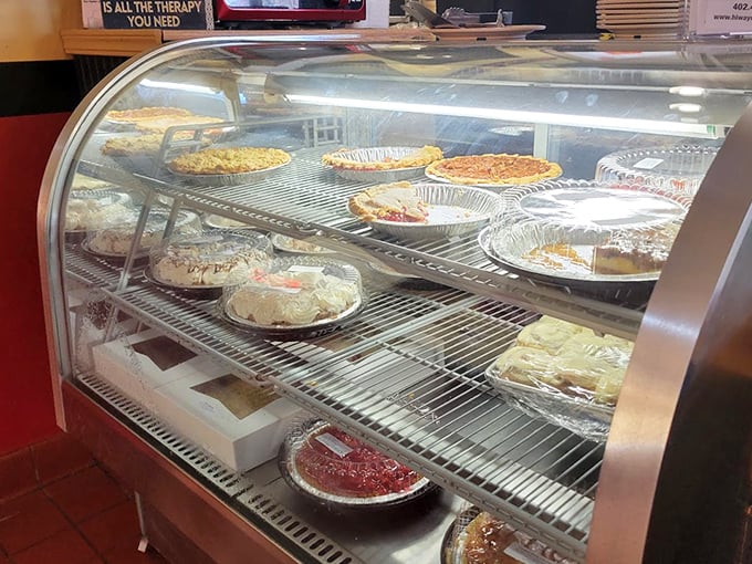 The dessert case &ndash; where willpower goes to die. Each pie and cake represents a different way to justify "just one slice."
