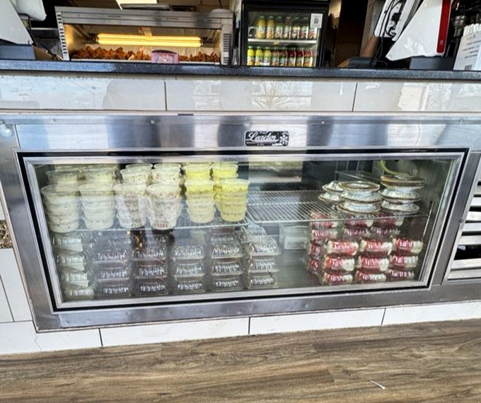 The refrigerated case holds sides and desserts waiting for their moment to shine. Supporting players that sometimes steal the show.