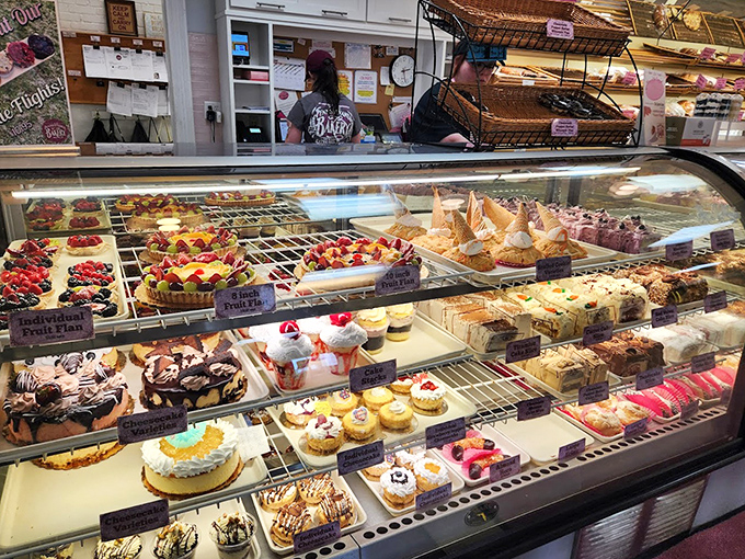 Dessert real estate at its finest. Each shelf offers a different neighborhood of flavor, from fruit-filled villas to chocolate-dipped estates.