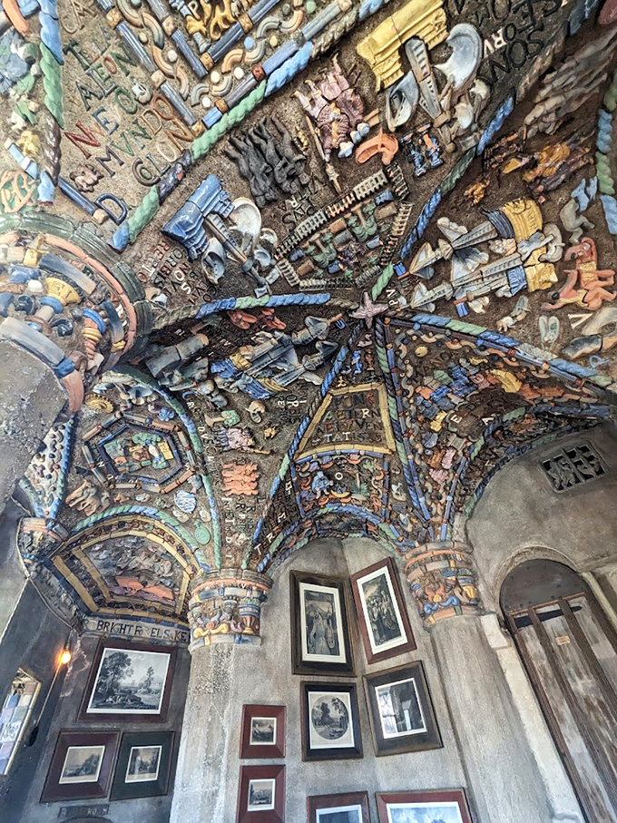 Look up! This kaleidoscopic ceiling transforms concrete into a canvas of color and symbolism. Michelangelo would have either applauded or thrown down his brushes.