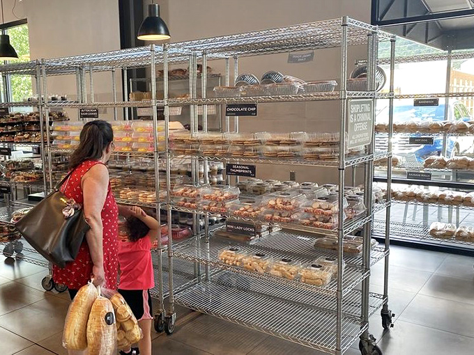 Shopping becomes a family affair as generations bond over shared decisions. "One of each" is always a valid bakery strategy.