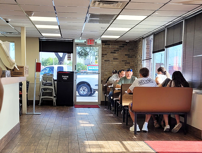The moment of anticipation—customers at the counter about to experience burger nirvana. The "Best Deal is a Combo Meal" sign speaks truth.
