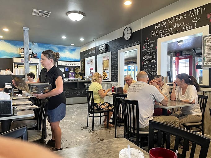 Where WiFi is absent but conversation flourishes. That chalkboard menu whispers, "Put down your phone and pick up your fork."