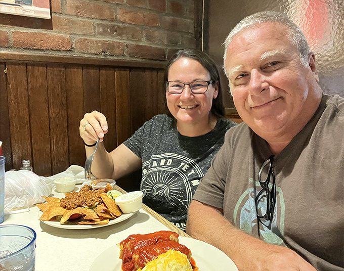 Happy diners caught in that magical moment when good food, good company, and a great local restaurant come together in perfect harmony.