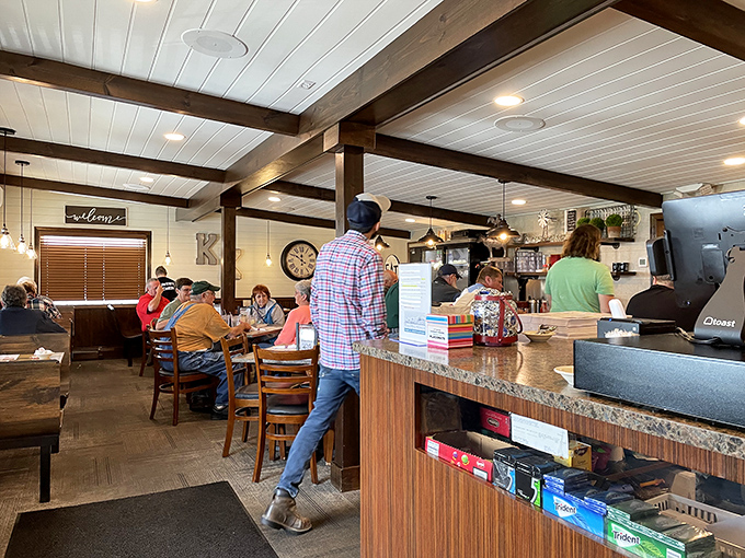 The dining room hums with conversation while "EAT" signs state the obvious mission we're all here to accomplish.