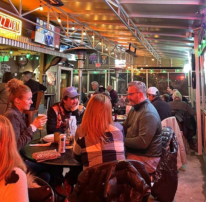 Where strangers become friends over shared pizza passion. Notice how nobody's looking at their phones? That's the Burt's effect.