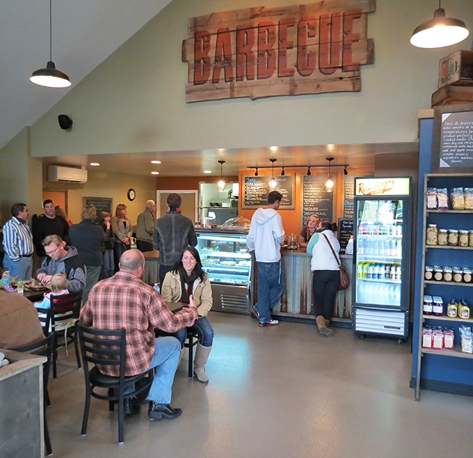 The dining room fills with happy carnivores, united in their appreciation for properly smoked meat.