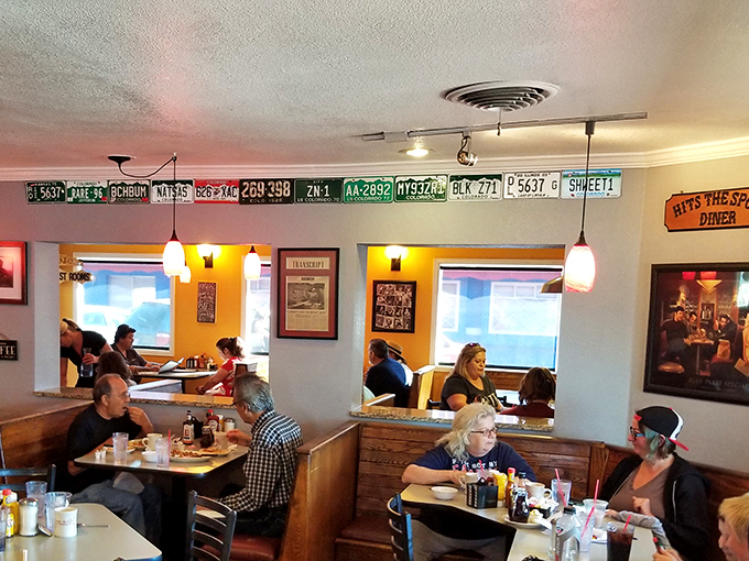 License plates lining the walls tell the story—people drive from all corners of Colorado for these legendary breakfast creations.