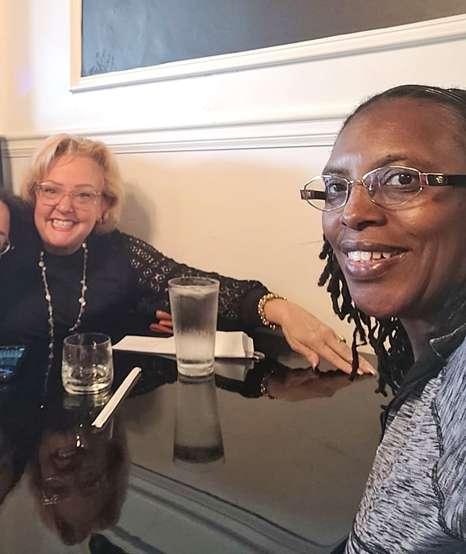 Happy diners sharing stories and sips&mdash;the universal language of "this food was worth getting out of bed for."