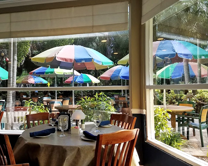 From this table by the window, you can watch colorful umbrellas dance in the breeze while planning your next seafood selection.
