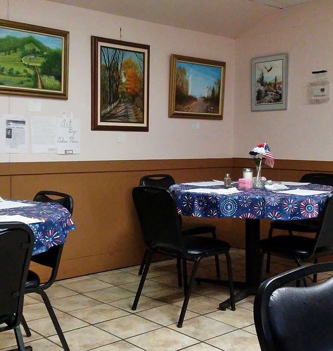 Simple tables with patriotic tablecloths and local artwork – the stage is set for food that doesn't need fancy surroundings to shine.