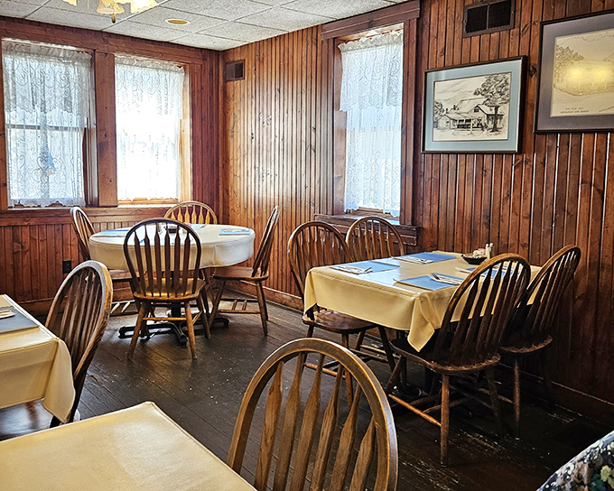 Simple tables dressed in yellow cloths create dining spaces that feel both special and familiar, like Sunday dinner at your favorite relative's house.