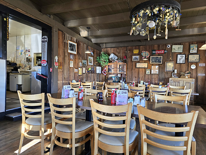 The chandelier of spoons watches over diners like a quirky guardian angel. In this wood-paneled sanctuary, calories don't count and memories multiply.
