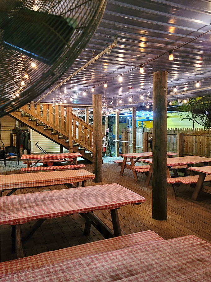 String lights and picnic tables create an outdoor dining experience that feels like the world's best backyard barbecue party.