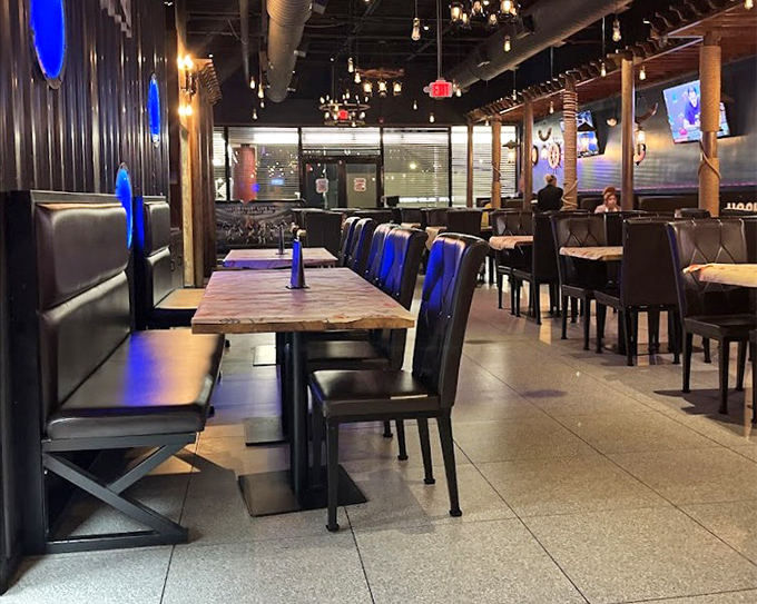 Modern meets maritime in this dining area where blue lighting creates the perfect atmosphere for seafood indulgence. 