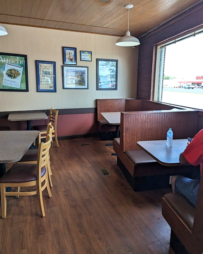 Wooden booths worn smooth by generations of satisfied diners create the perfect setting for the serious business of enjoying Barberton's famous fried chicken.