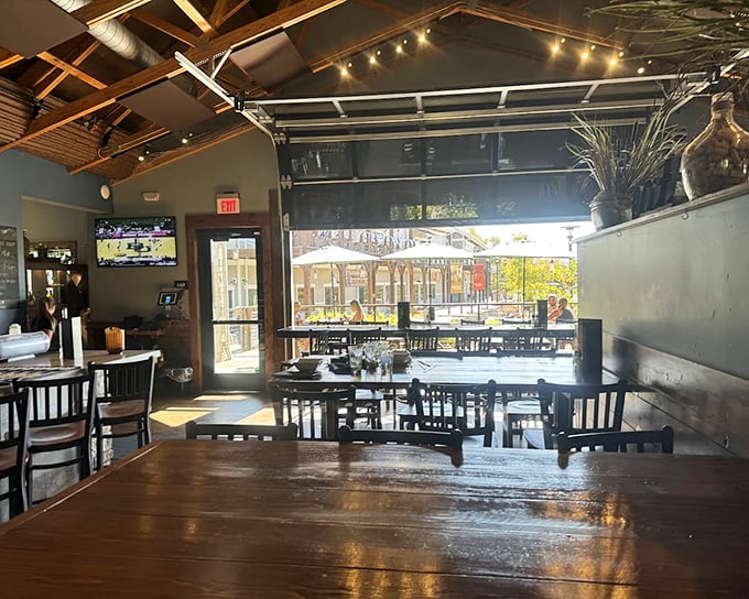 Sunshine streams through garage-style doors, turning an ordinary dining room into a light-filled sanctuary for serious eating.