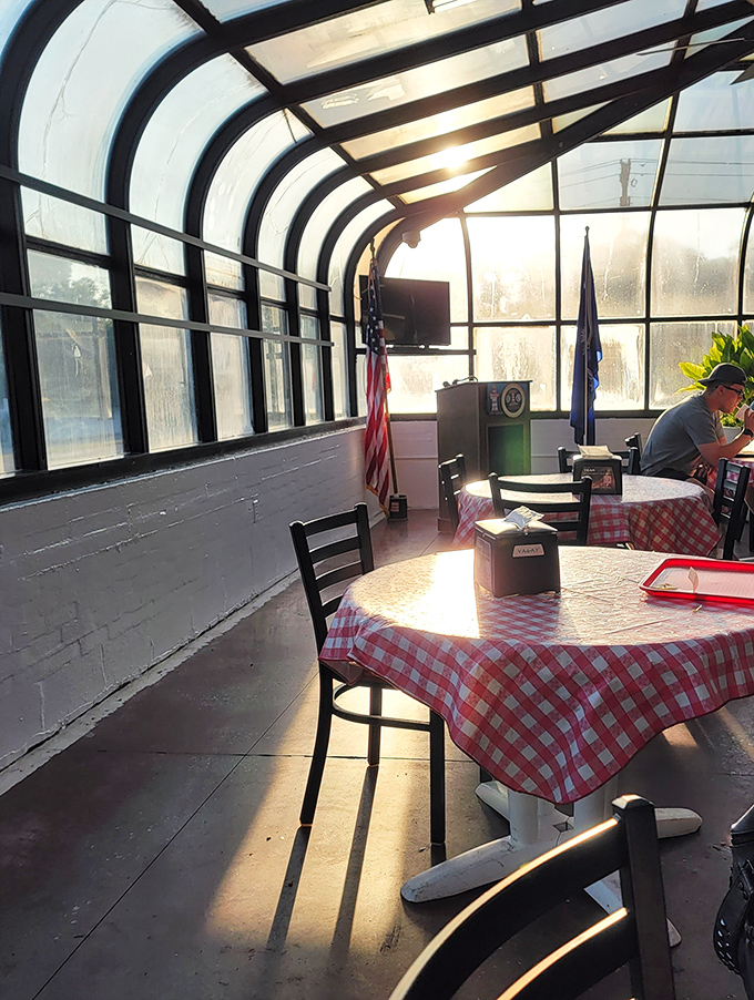The sunlit dining area where red-checkered tablecloths have hosted more South Carolina political deals than the actual State House in Columbia.