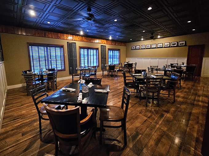 Another dining space offers a quieter, more intimate setting with polished wood floors and classic furnishings&mdash;perfect for conversation without competition.