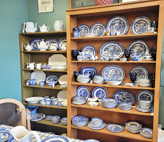 Blue Willow china displayed with reverence. These plates have served countless Sunday dinners and holiday feasts across generations.