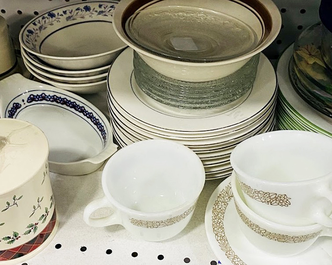 Dishes stacked with stories of dinner parties past. These mismatched treasures await new tables where they'll witness fresh conversations and family meals.