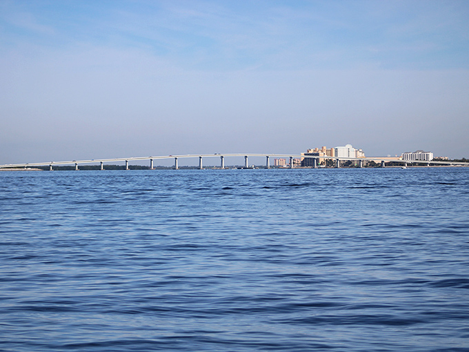 From a distance, the causeway appears to float on the water, a man-made miracle connecting island dreams to mainland practicalities.
