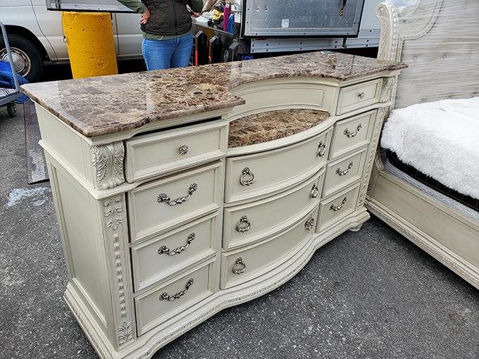 Furniture that whispers of elegance with its marble top and cream finish. Someone's living room is about to get a serious upgrade.