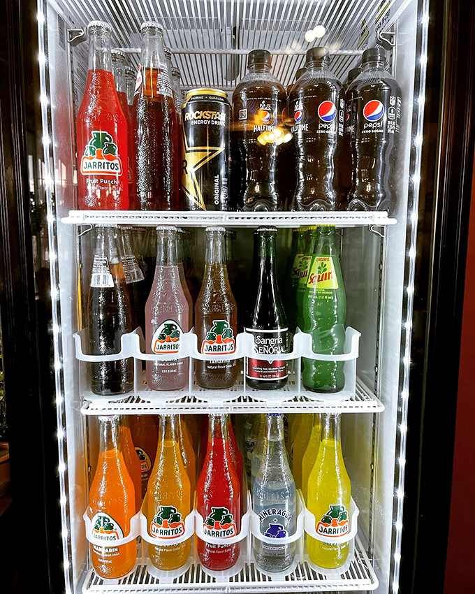 That rainbow selection of Jarritos sodas brings back memories of childhood, when every color promised a different flavor adventure ahead.