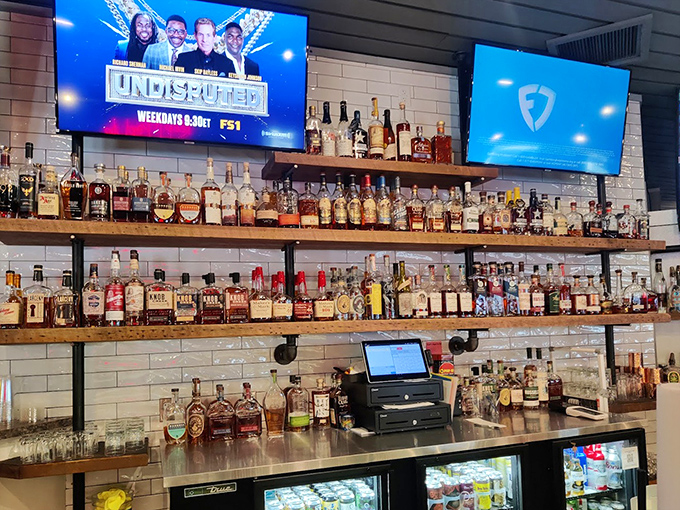 A bar stocked better than most therapists' offices, because sometimes the best medicine comes in a glass after hot chicken.