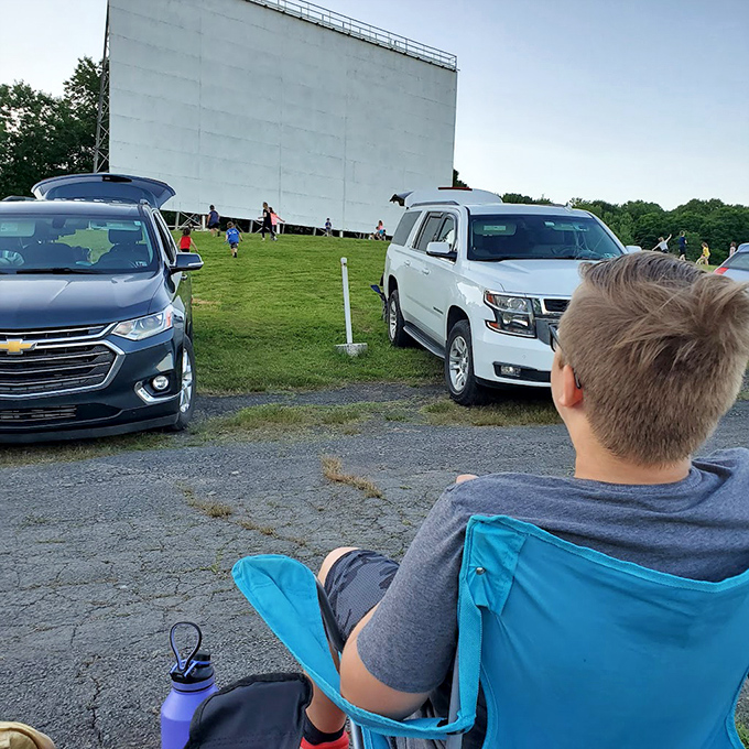 Children play in the grassy area before showtime, burning energy before settling in for Hollywood magic under Pennsylvania stars.