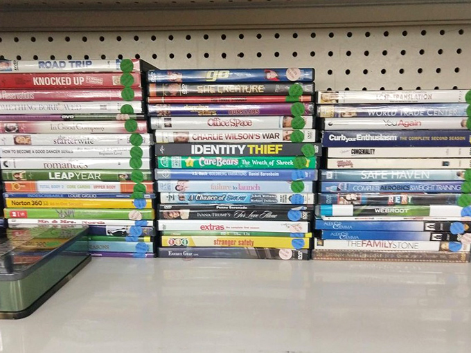 DVDs stacked like a Blockbuster time capsule &ndash; remember when Friday night meant actual video store trips?