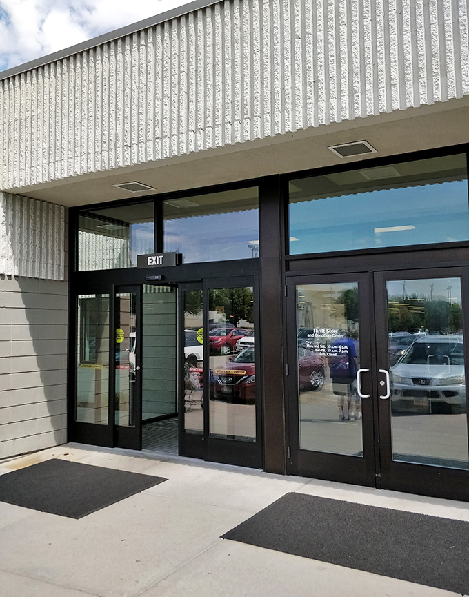 The modern entrance welcomes a steady stream of hopeful hunters, each one chasing that unique thrill of the perfect thrift store find.