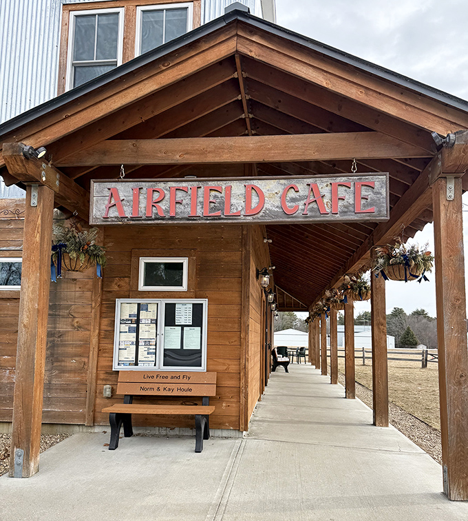 The wooden entrance says "rustic charm," but the sign promises "great food with a view." Both deliver without reservation.