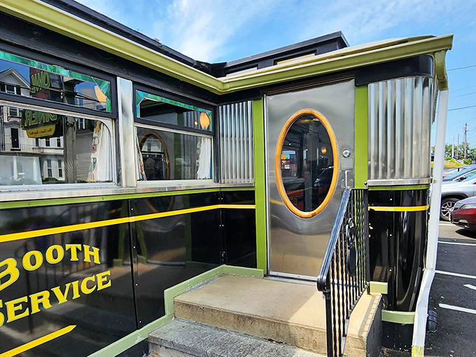 "Booth Service" in gleaming yellow letters promises the authentic diner experience before you even step through that perfectly vintage doorway.